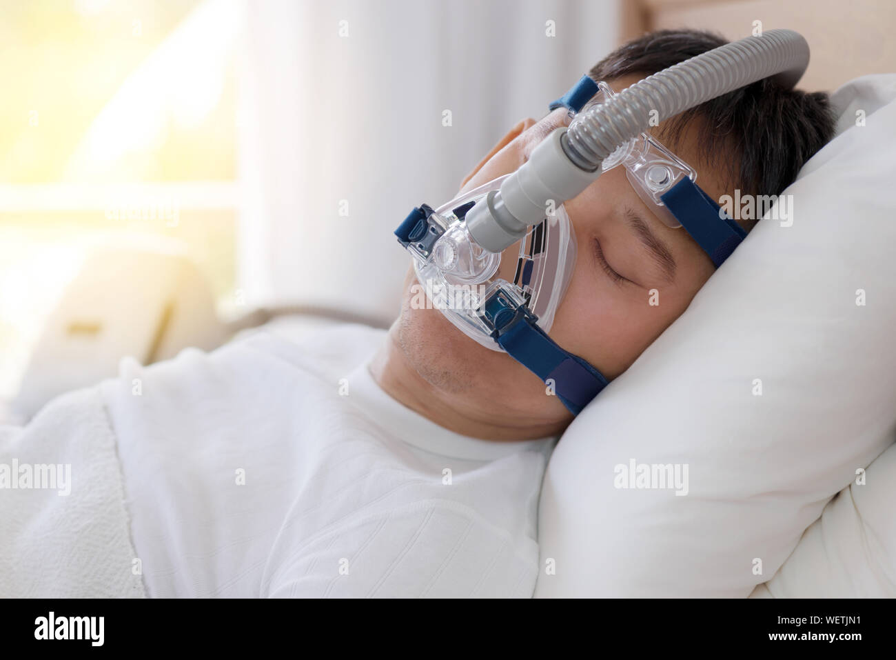 Man sleeping in hospital bed hi-res stock photography and images - Alamy