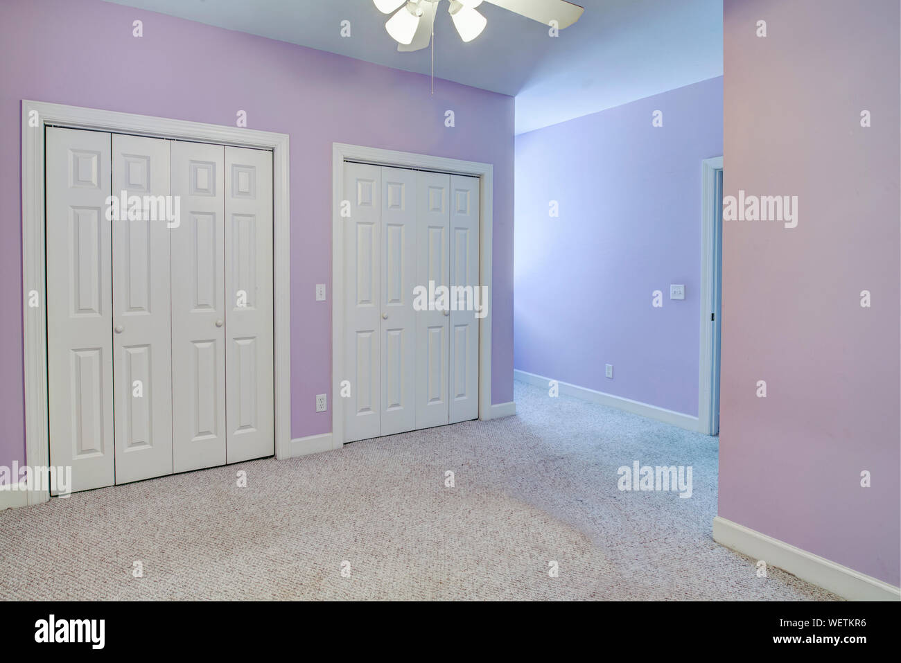 Simple empty, bedroom with double closets Stock Photo - Alamy