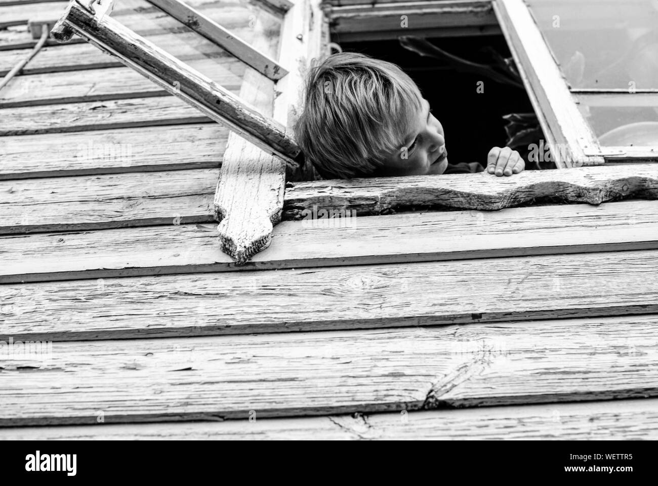 Person looking through window exterior Black and White Stock Photos ...
