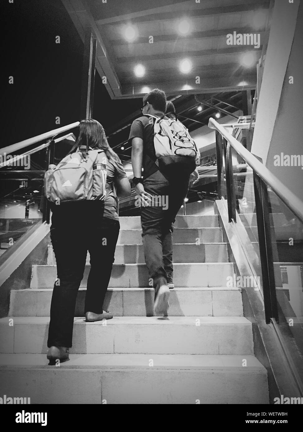 Rear view climbing stairs hi-res stock photography and images - Alamy