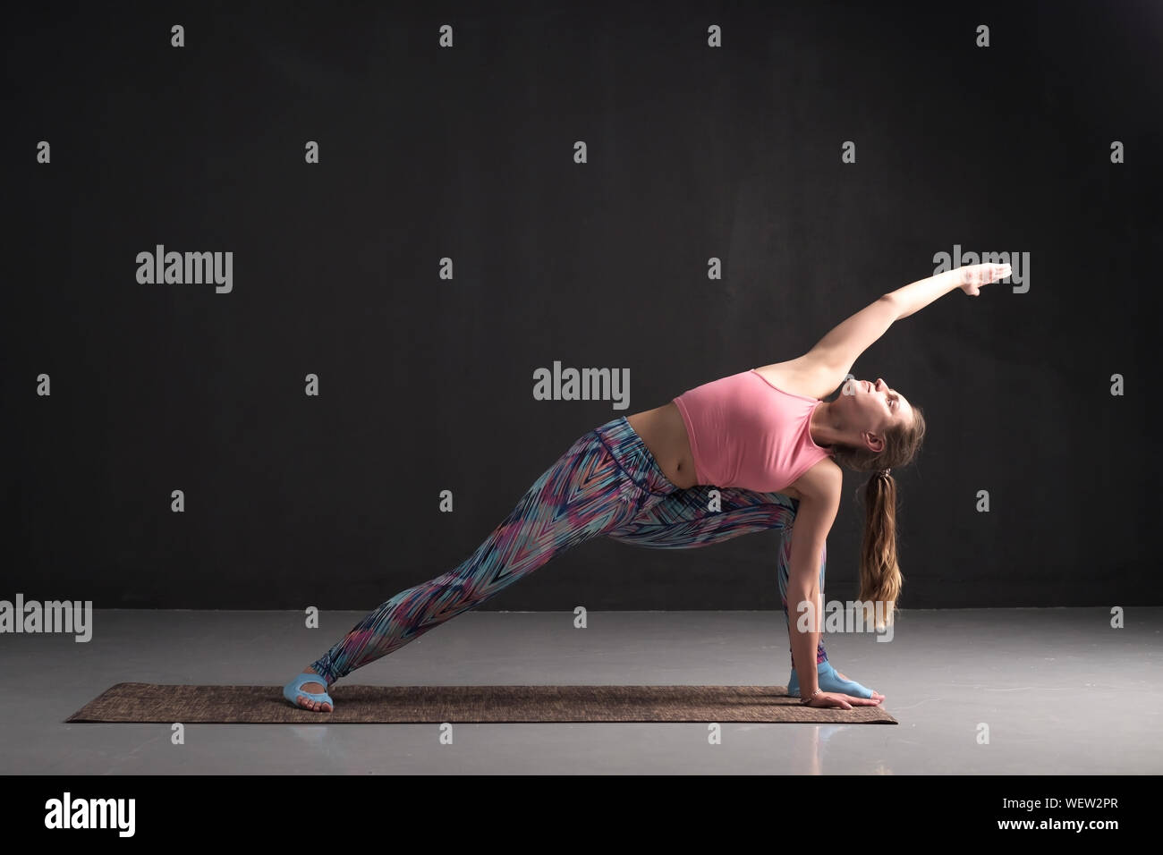 Yoga standing twist hi-res stock photography and images - Alamy