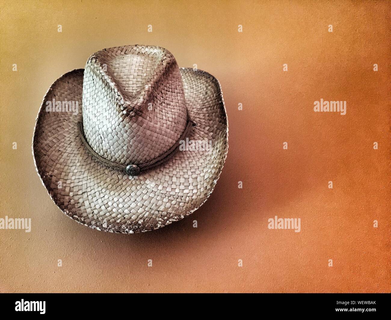 Cowboy hat hanging on wall hi-res stock photography and images - Alamy