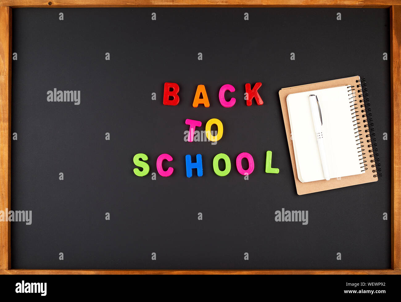 inscription back to school from multi-colored plastic letters and a ...