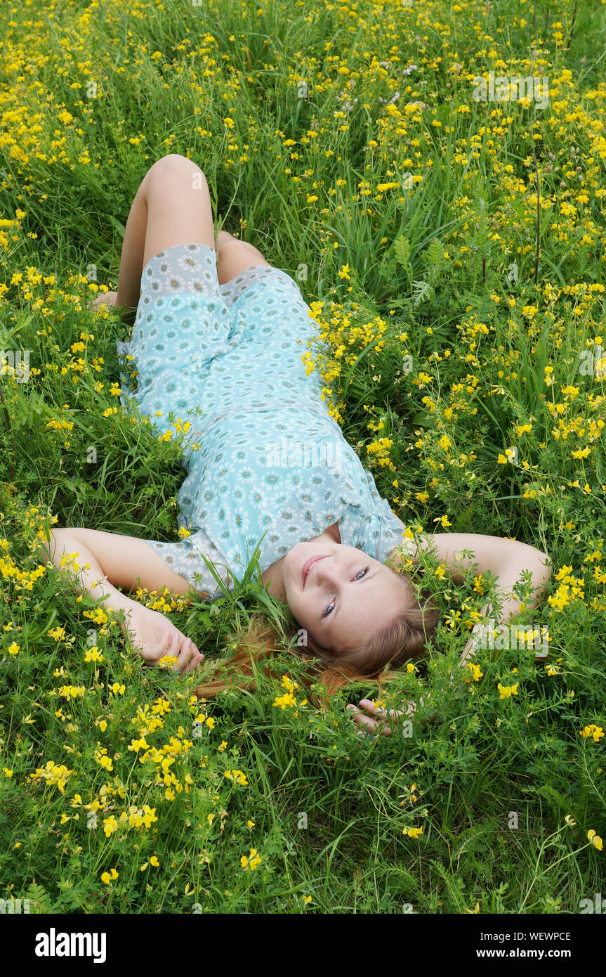 Back of woman in green dress field hi-res stock photography and images ...