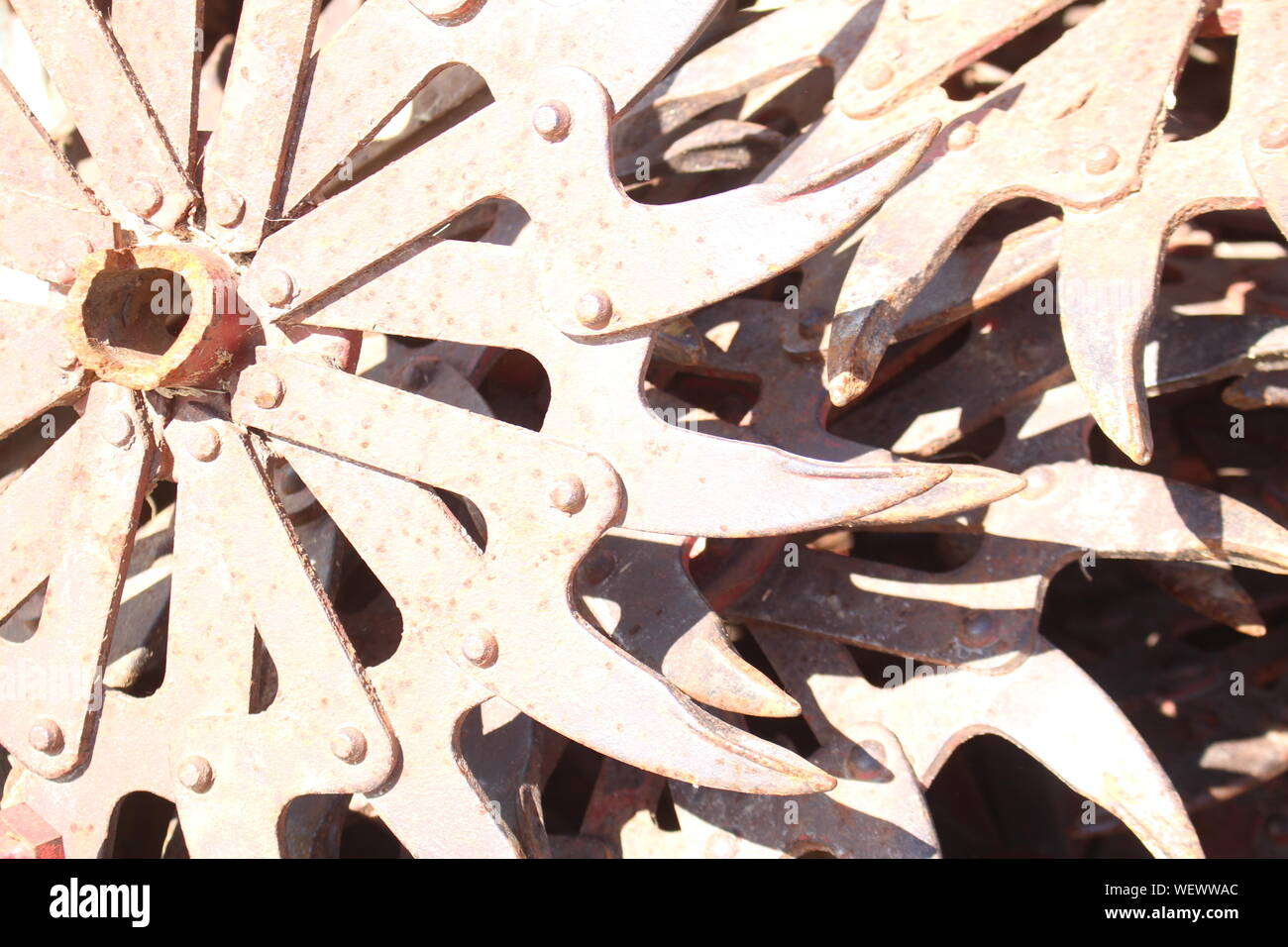 star shaped farming parts rusted Stock Photo - Alamy
