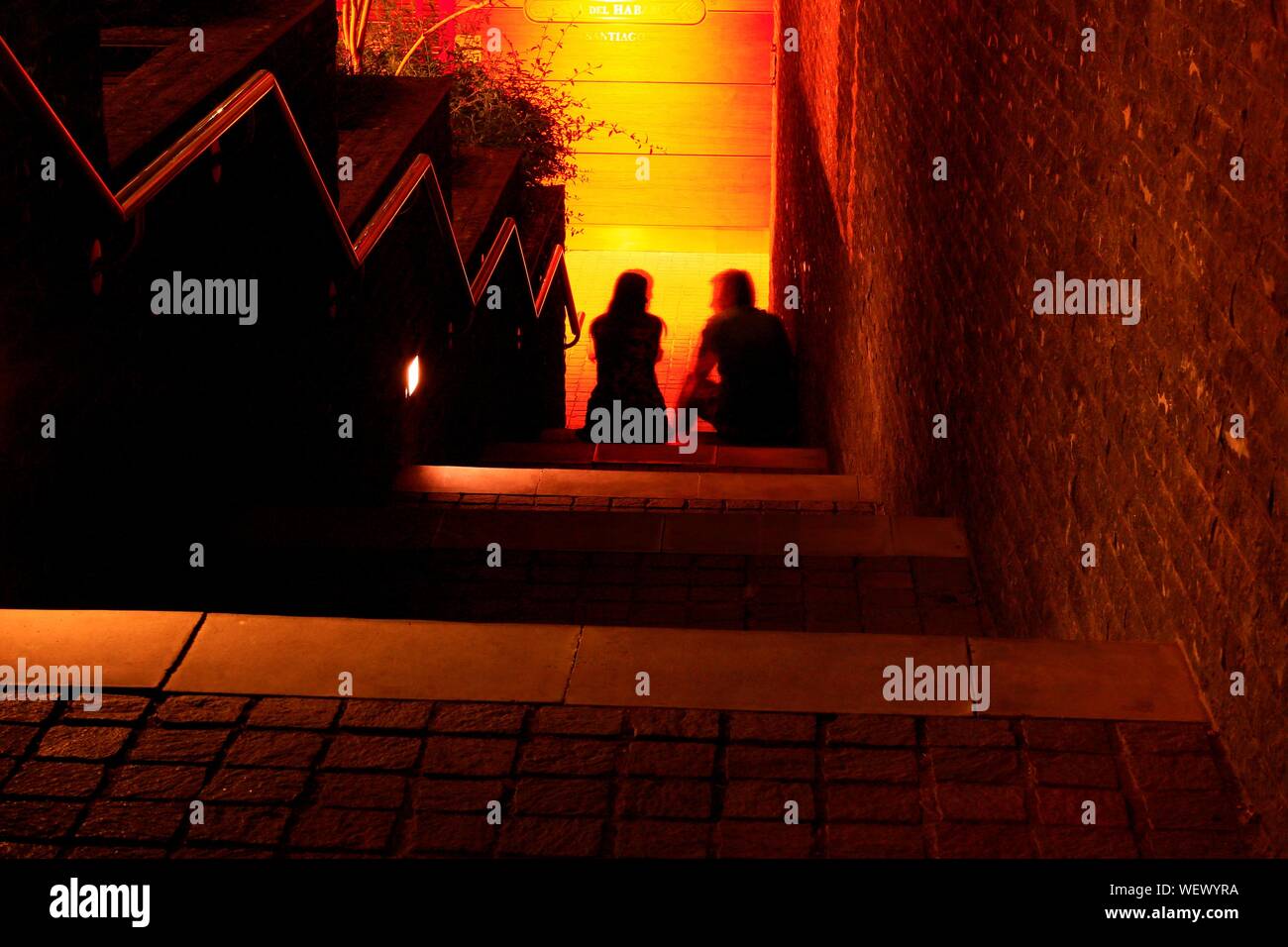 Sitting on steps night hi-res stock photography and images - Alamy