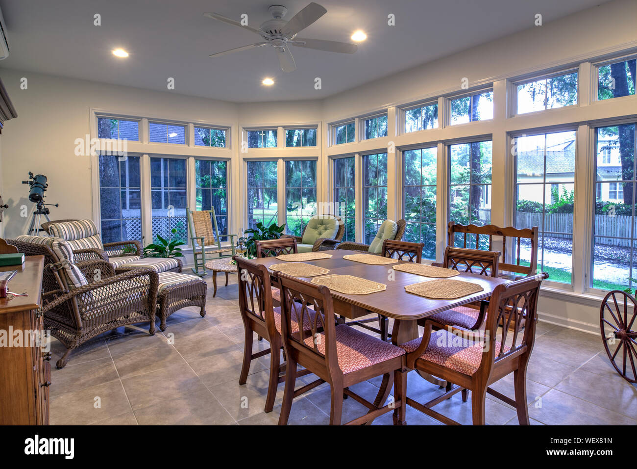 Beautiful sunroom with table and chair and lots of windows Stock Photo ...