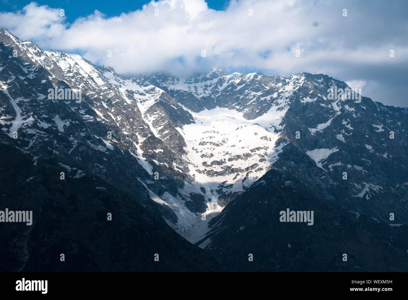 Great green mountain ranges. Peaks surrounded by green plants and a ...