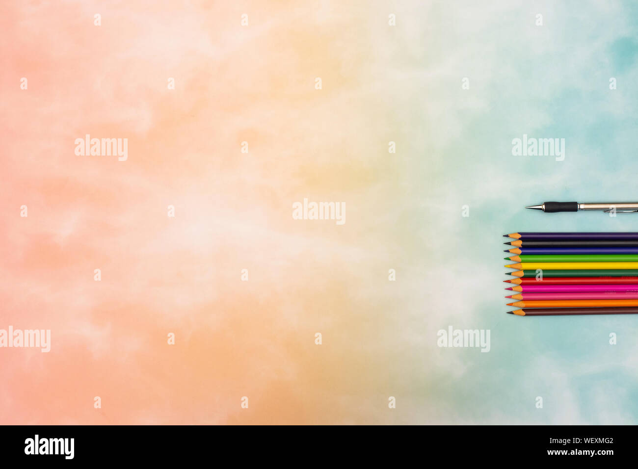 Colored pencils on the table for art work Stock Photo - Alamy