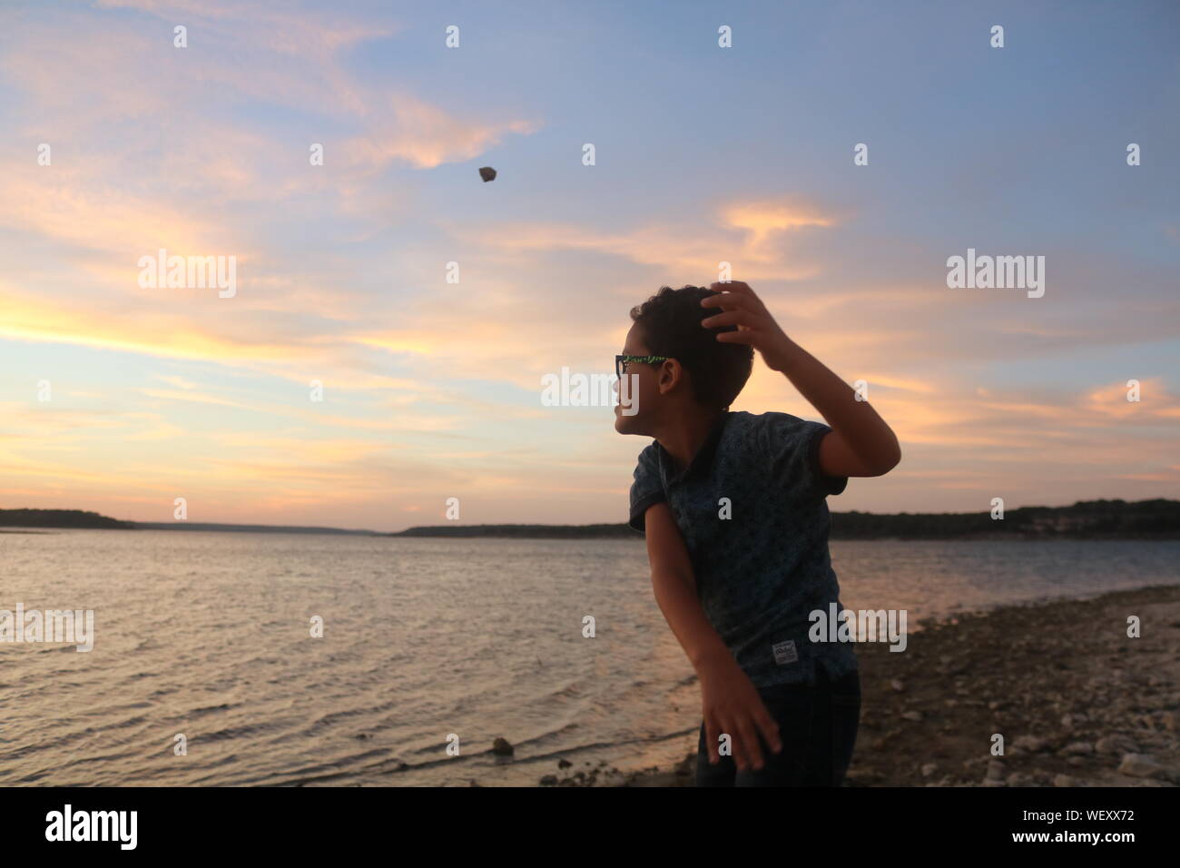Throwing Rock In Water High Resolution Stock Photography and Images - Alamy