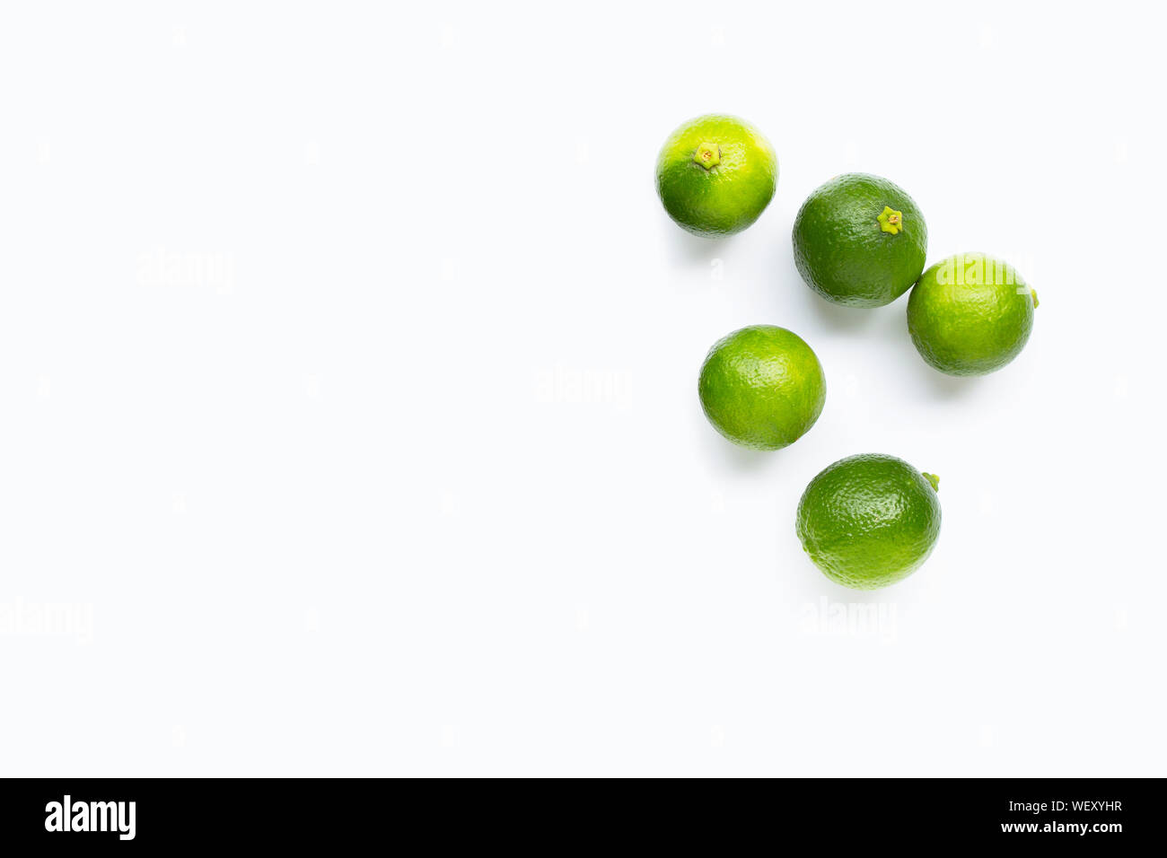 Limes isolated on white background. Copy space Stock Photo - Alamy