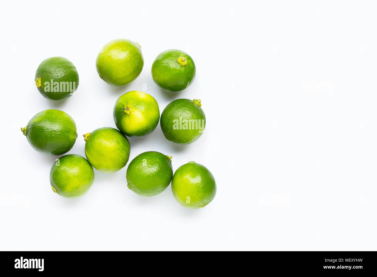 Limes isolated on white background. Copy space Stock Photo - Alamy