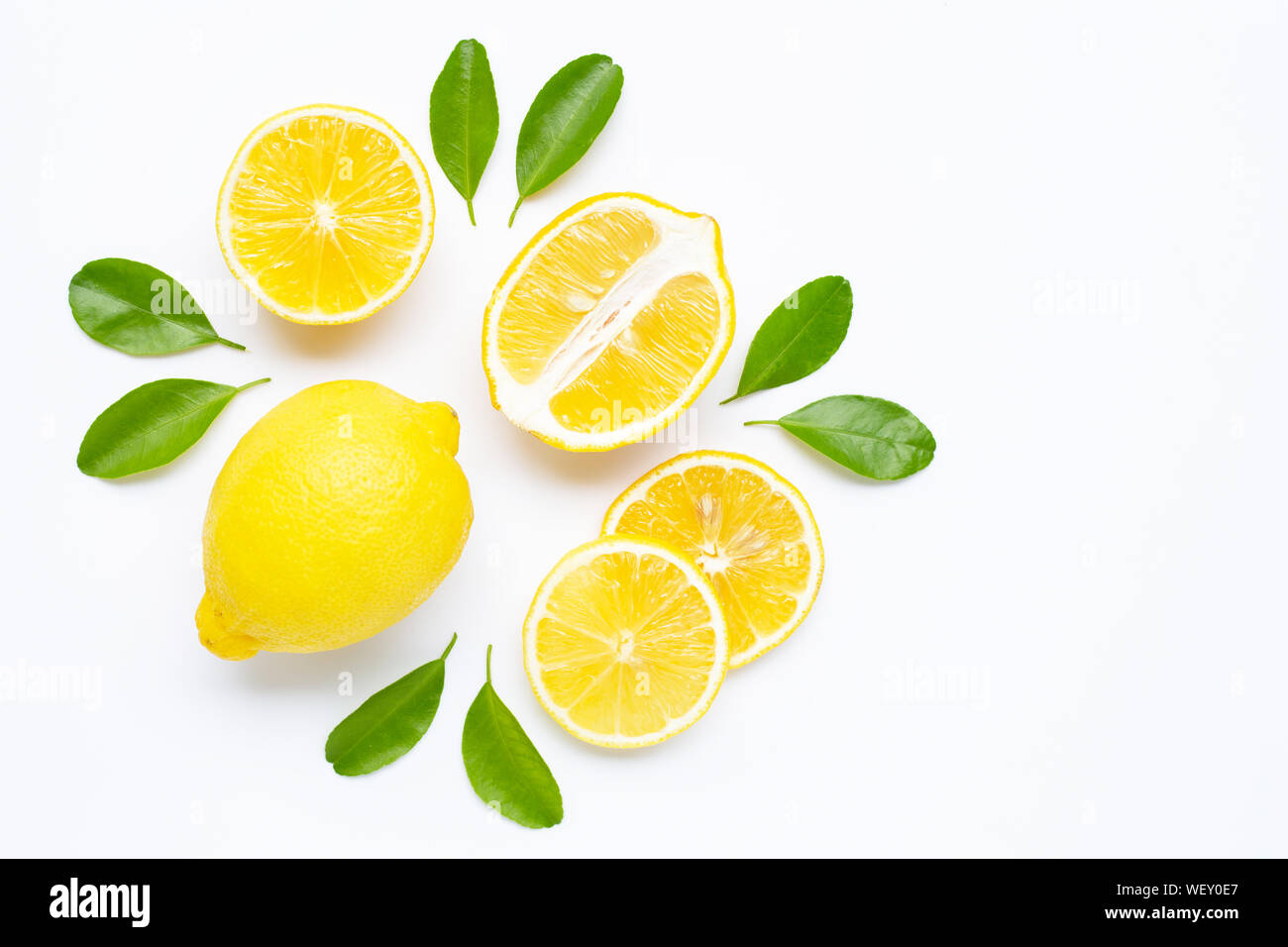 lemon and slices with leaves isolated on white background Stock Photo ...