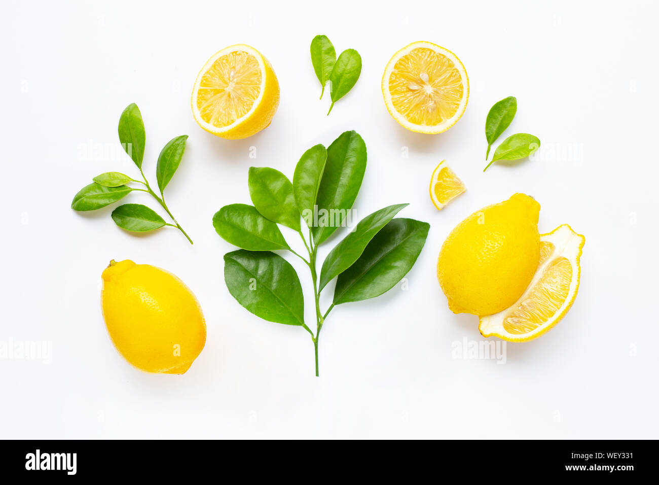 Fresh lemon with leaves isolated on white background Stock Photo - Alamy