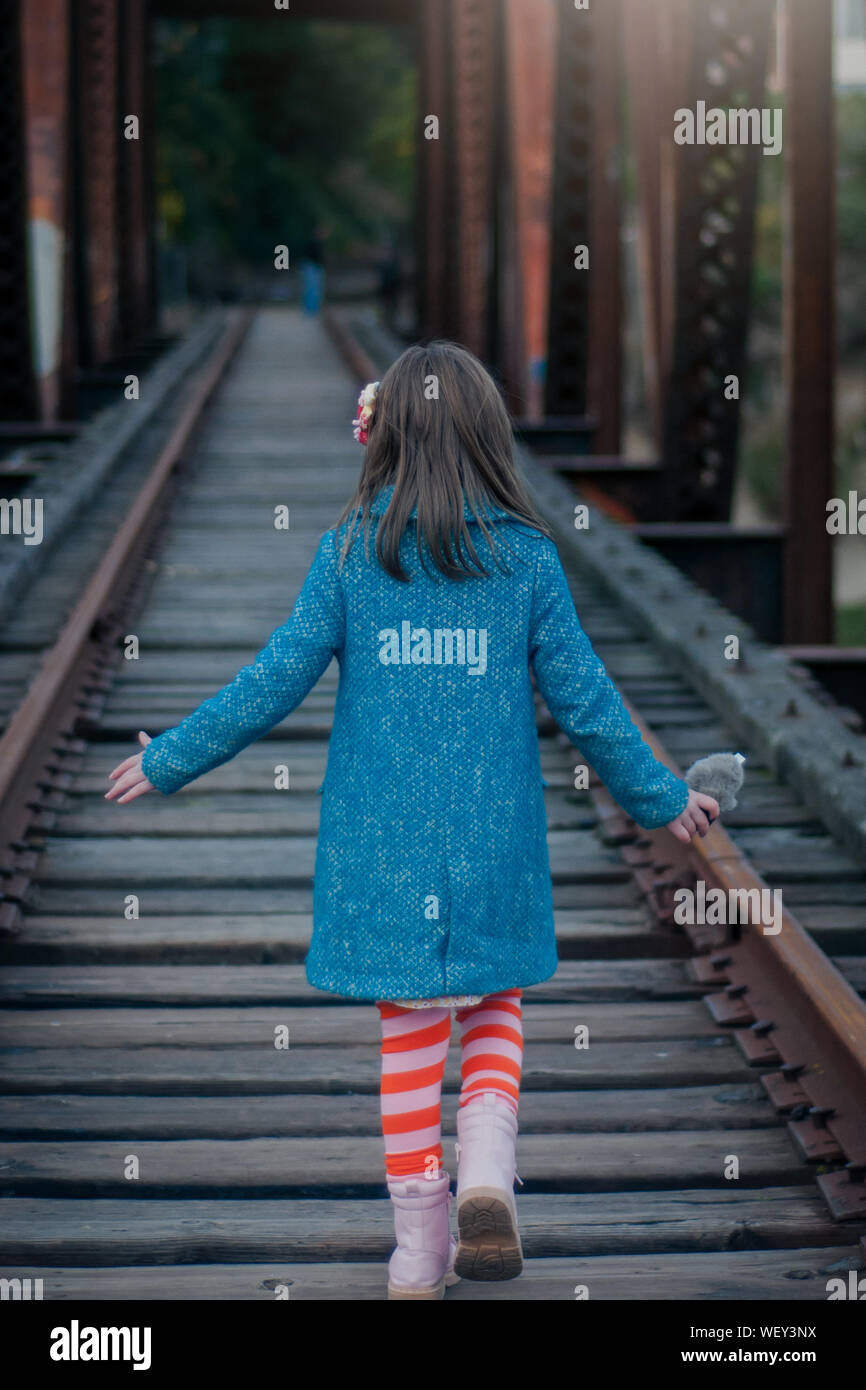 Girl walking on rail track hi-res stock photography and images - Alamy