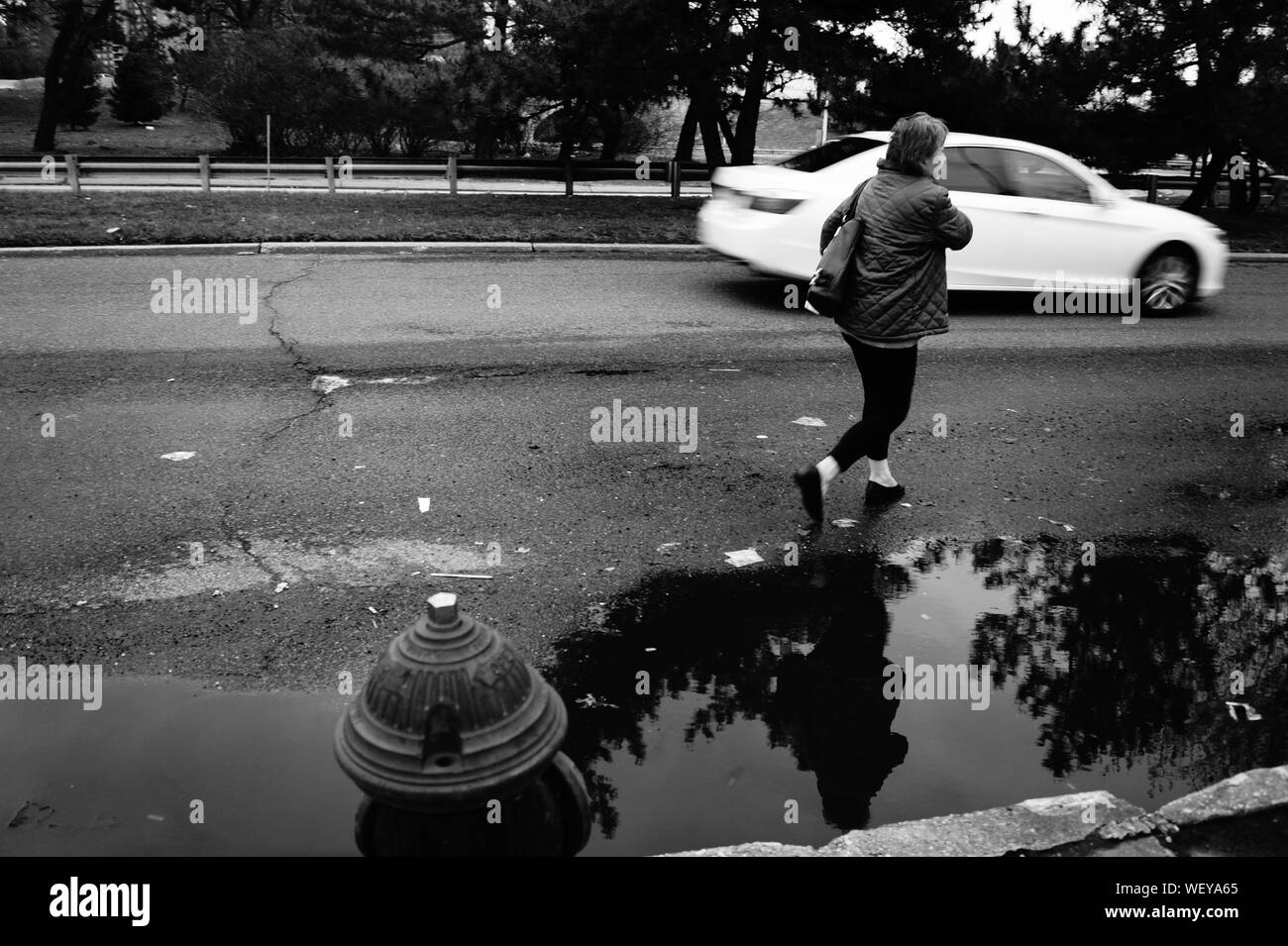 Car puddle person hi-res stock photography and images - Alamy