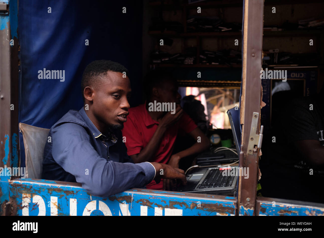 Kigali, Rwanda. 30th Aug, 2019. A man at a stall in Kimironko Market in ...