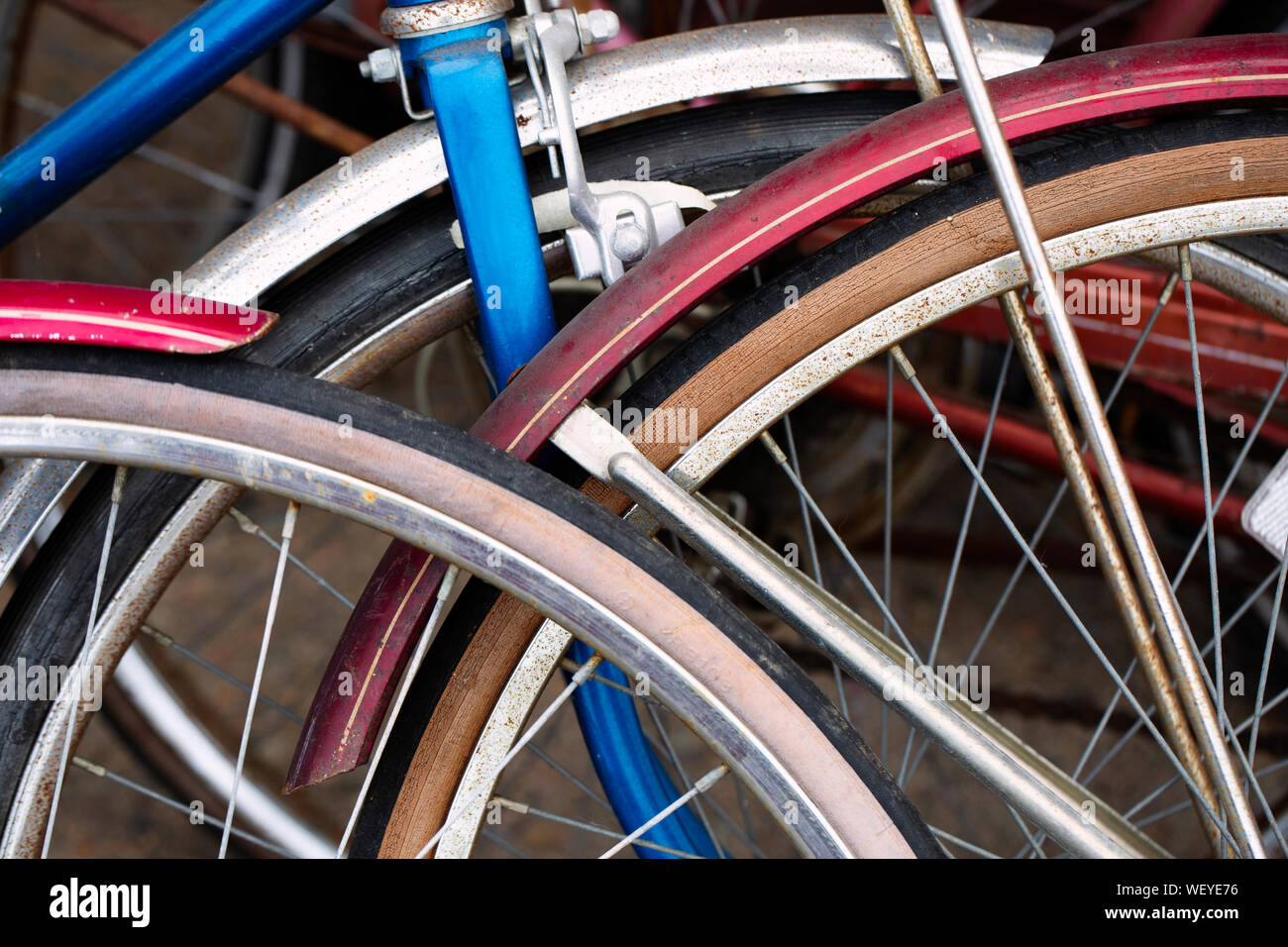 Close-up of group of vintage bicycle wheels Stock Photo - Alamy