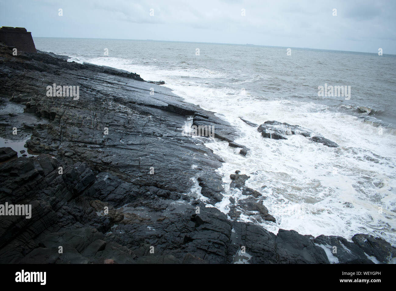 Rock formation on the side of a beach Stock Photo - Alamy