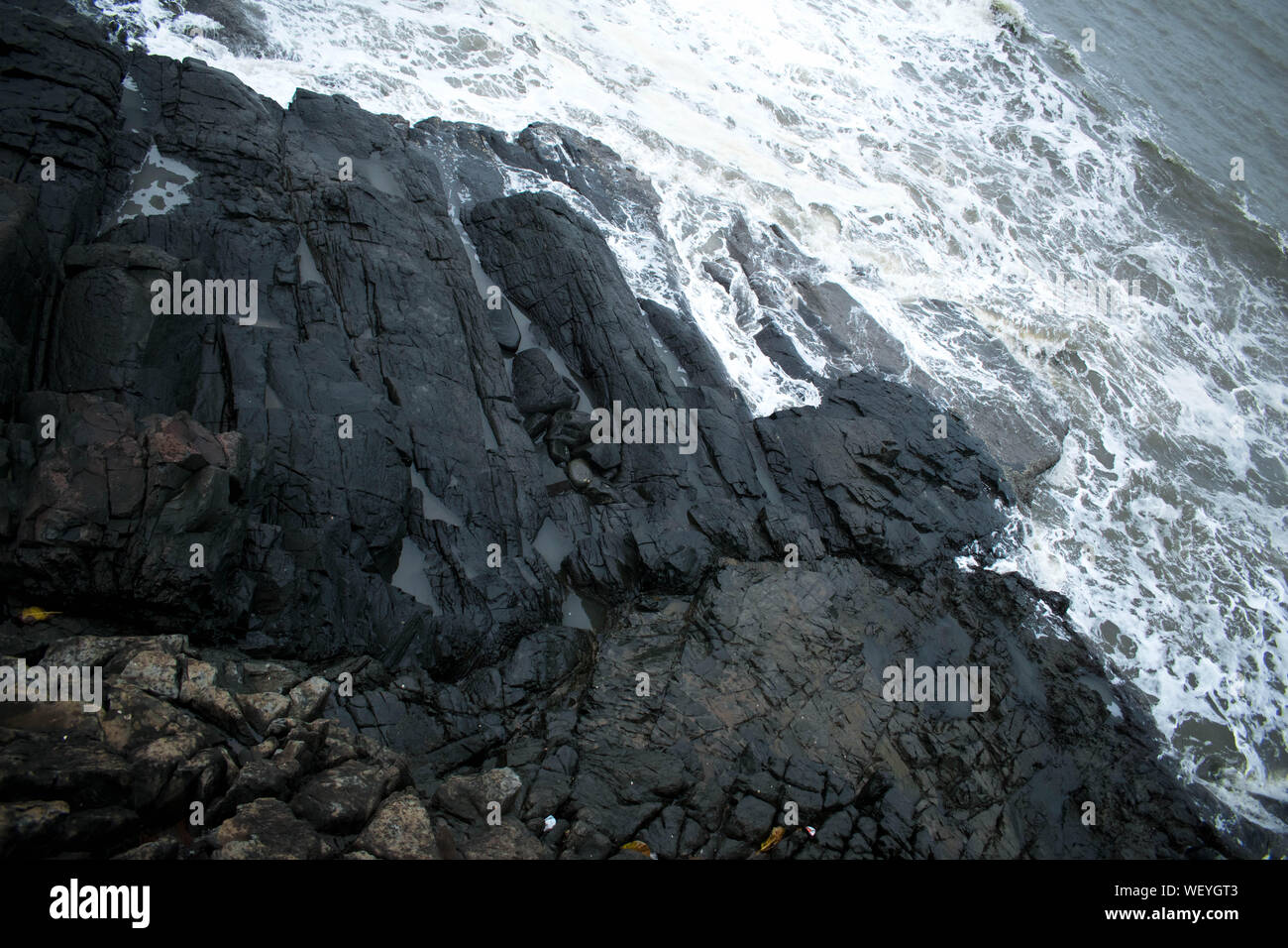 Rock formation on the side of a beach Stock Photo - Alamy
