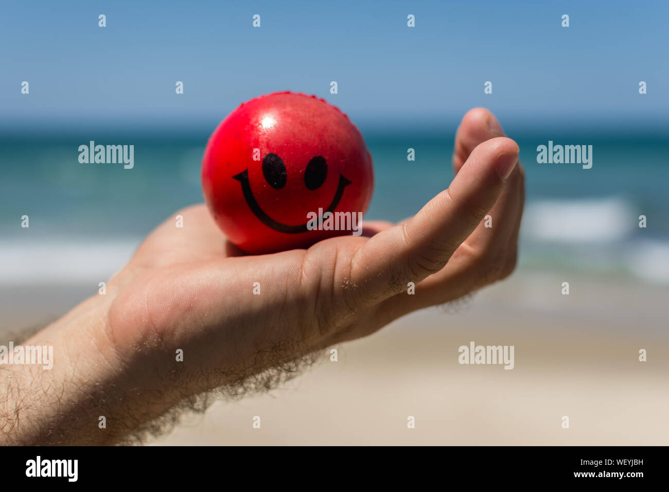 Smiley face beach ball hi-res stock photography and images - Alamy