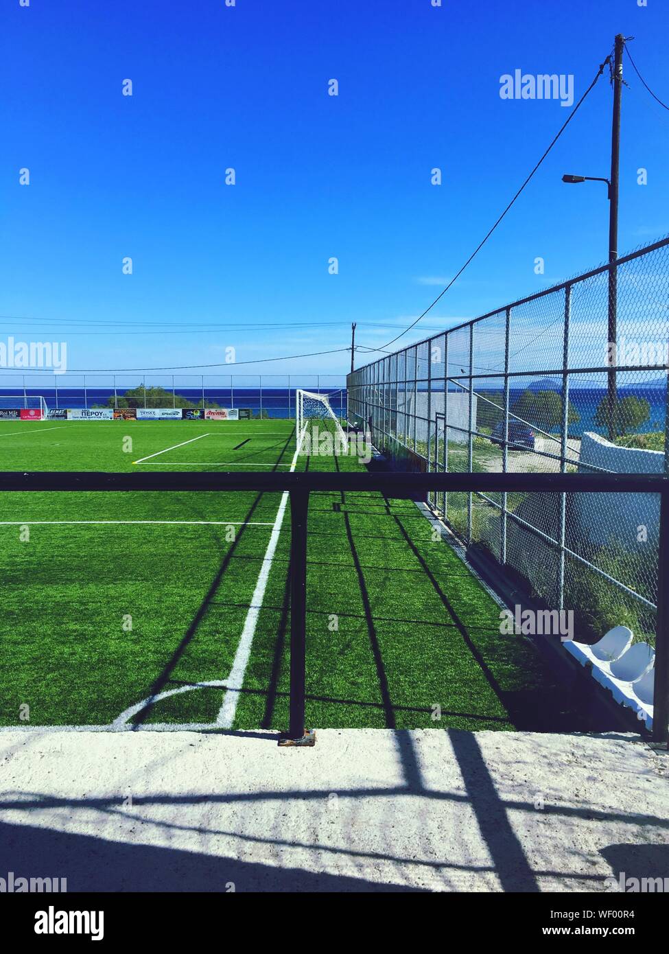 Football field blue sky hi-res stock photography and images - Alamy