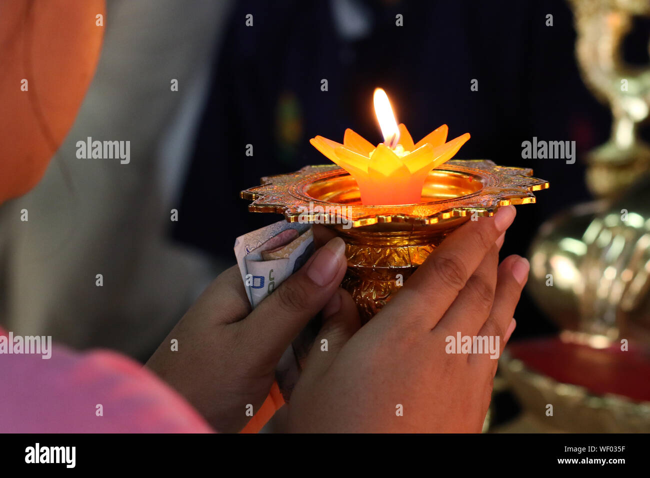 Hand holding diya hi-res stock photography and images - Alamy