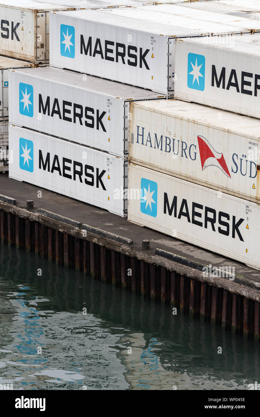 Sea cargo containers stacked and organized algorithmically on pier in ...