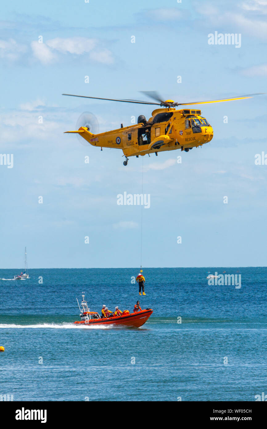 RAF Sea King Helicopter Winching Casualty from RNLI Atlantic 85 Class ...