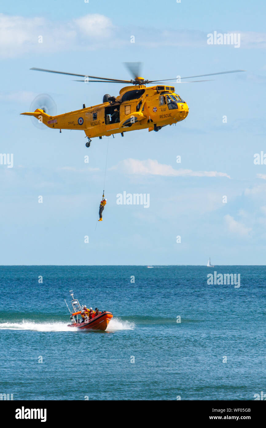 RAF Sea King Helicopter Winching Casualty from RNLI Atlantic 85 Class ...