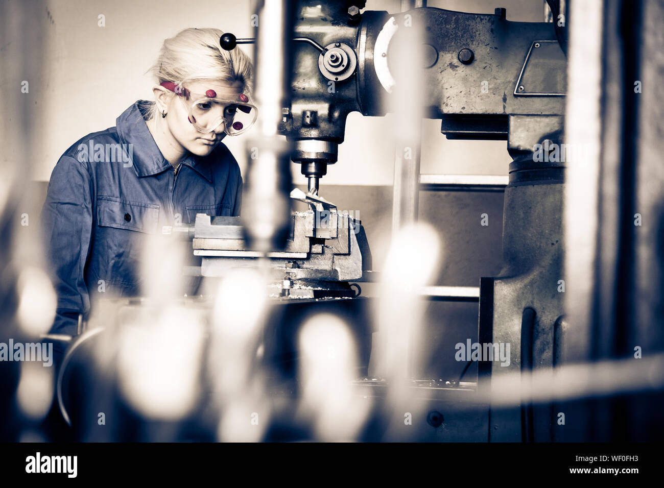 Female machine worker hi-res stock photography and images - Alamy