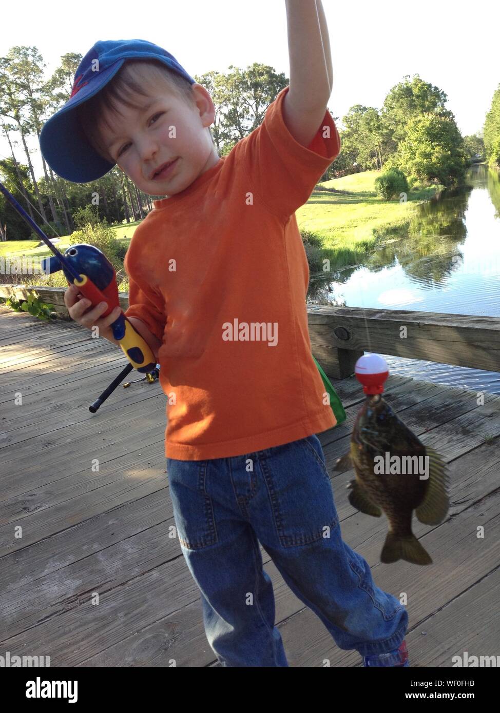 Boys on bridge fishing rod hi-res stock photography and images - Alamy