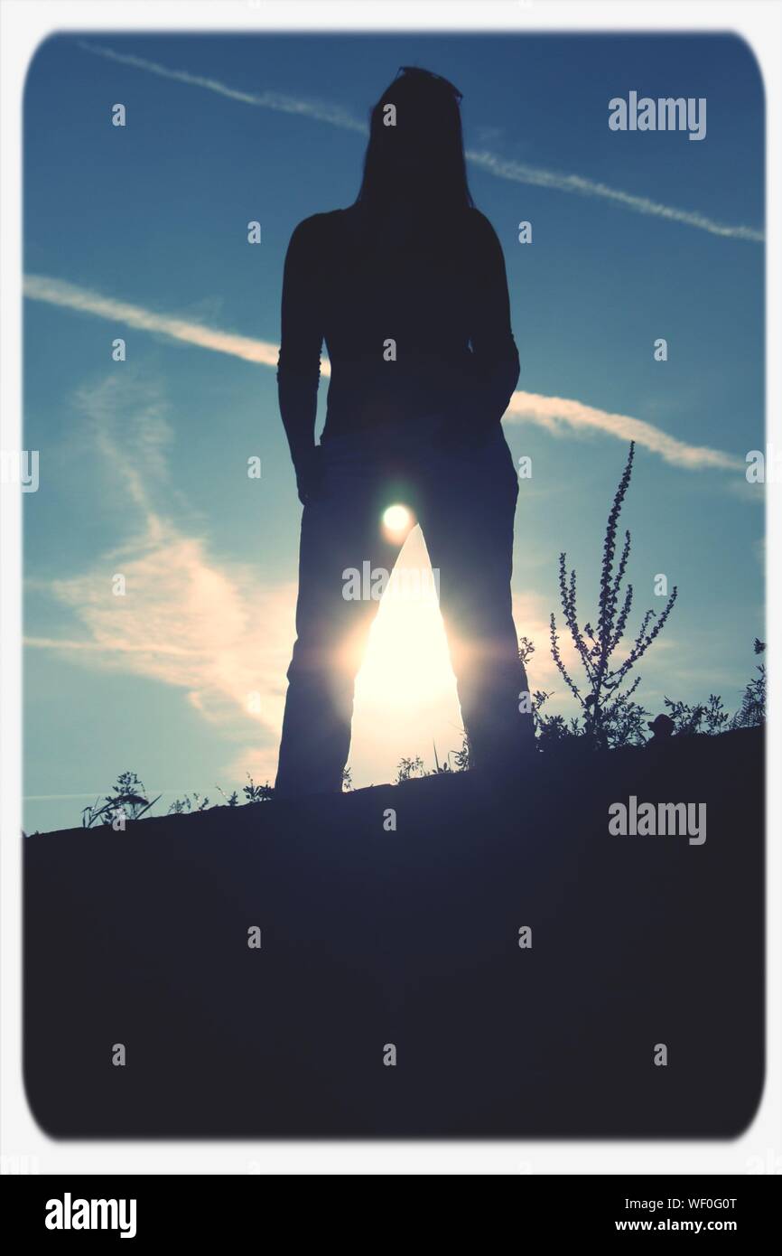 Standing sun light woman hi-res stock photography and images - Alamy
