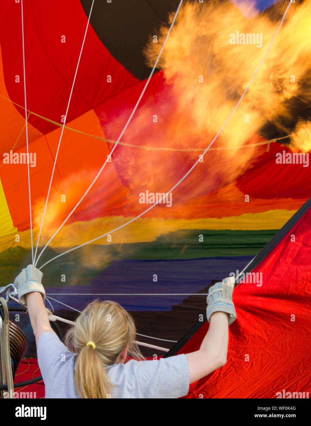 Woman inflating balloon hi-res stock photography and images - Alamy