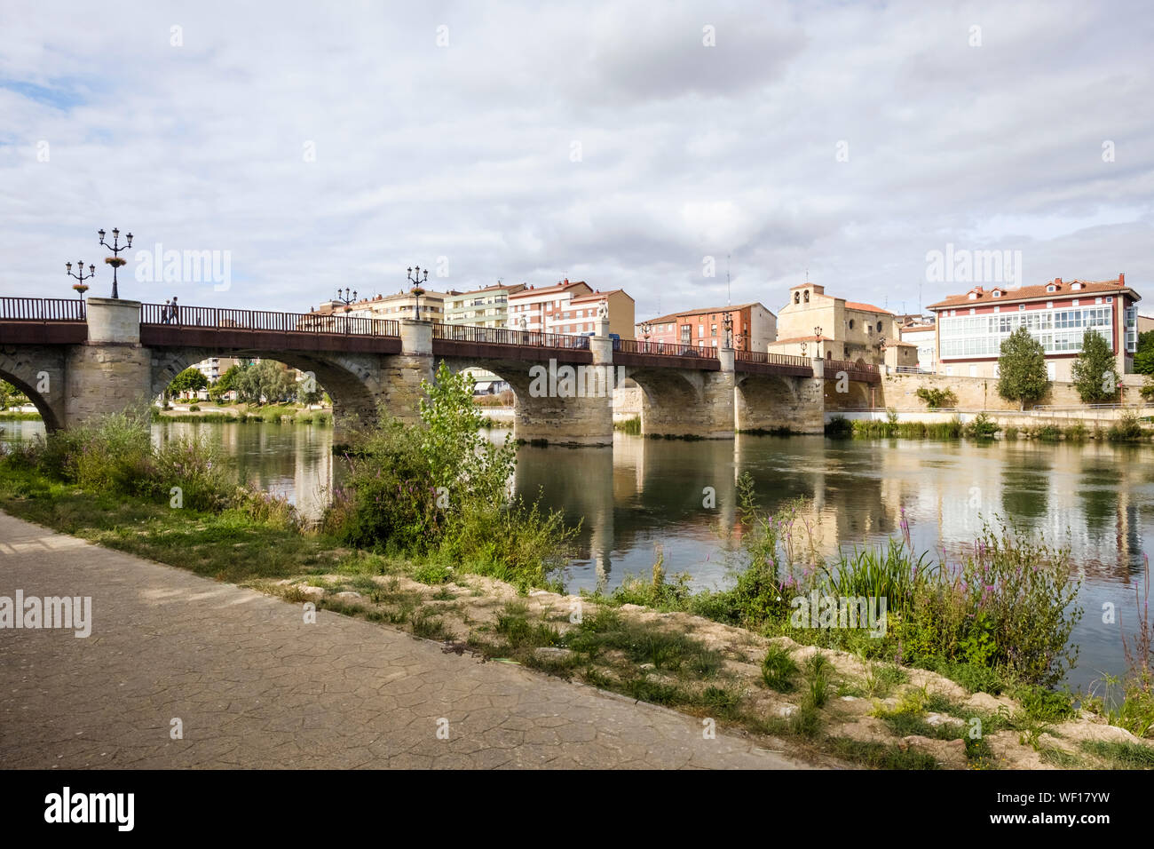 Riverwalk and historic Bridge of Carlos III over the River Ebro in ...