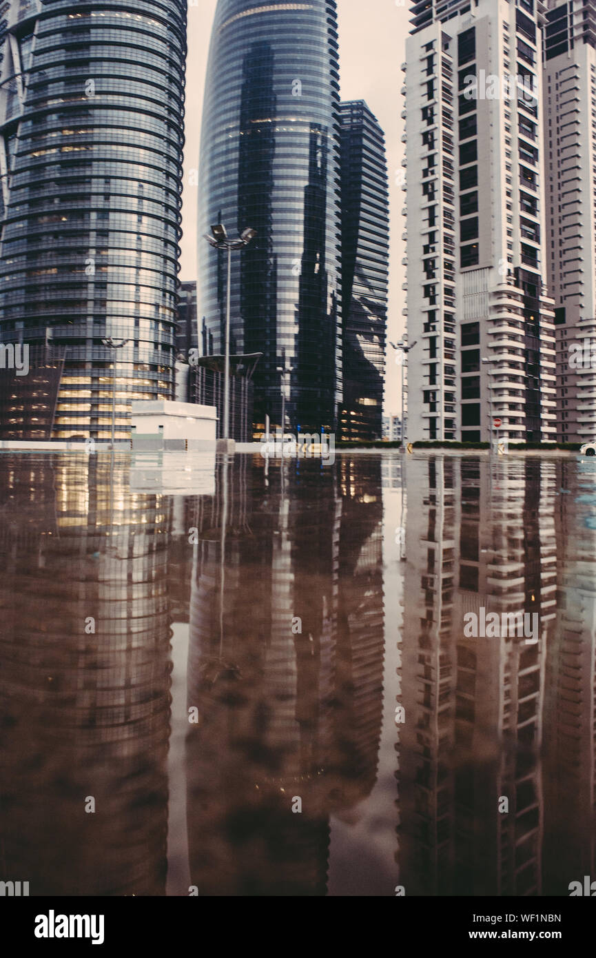 Modern Buildings Reflecting In Water Stock Photo - Alamy