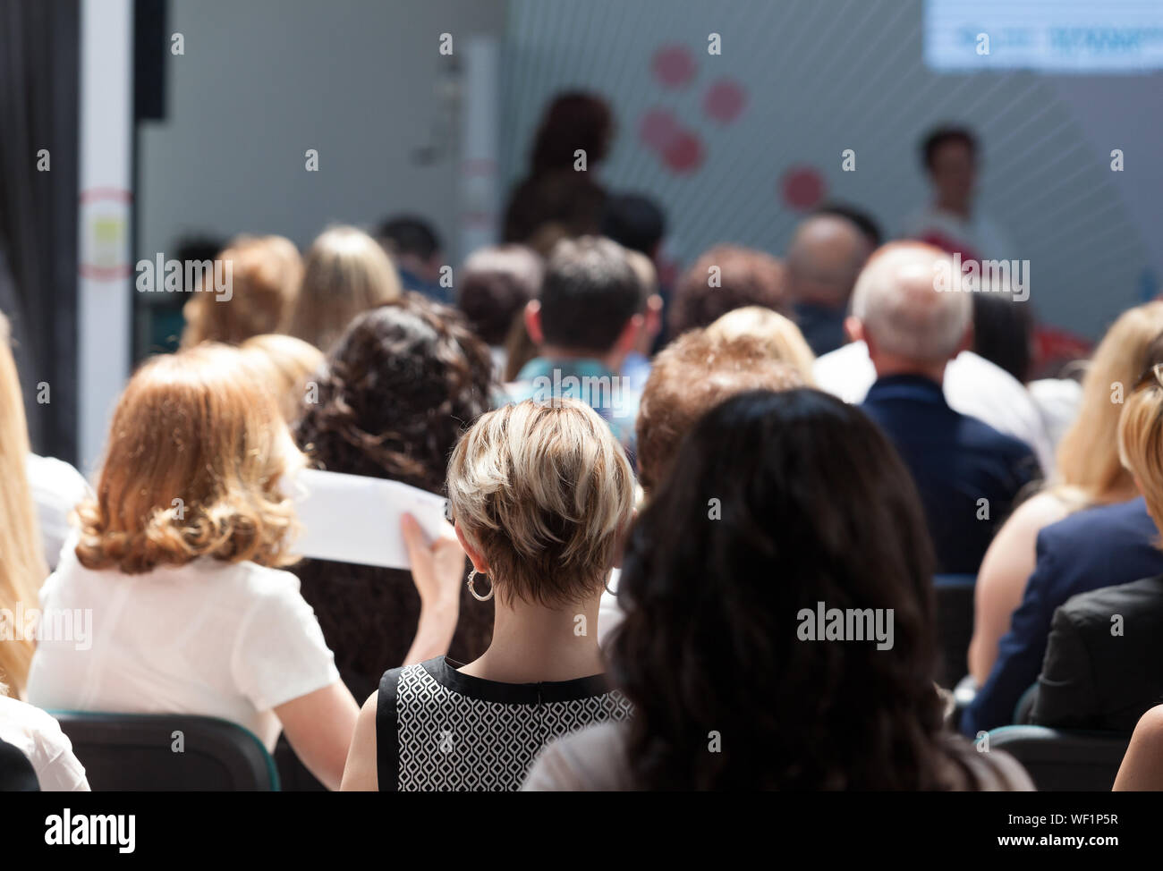 Event people sitting hi-res stock photography and images - Alamy