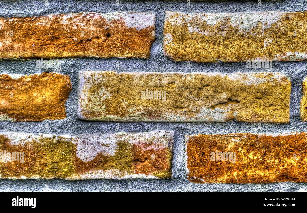 Very detailed texture of yellow brick walls on aged and weathered ...