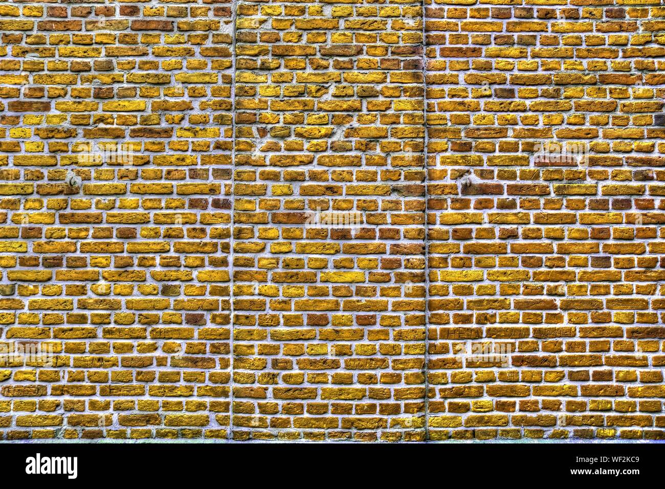 Very detailed texture of yellow brick walls on aged and weathered ...