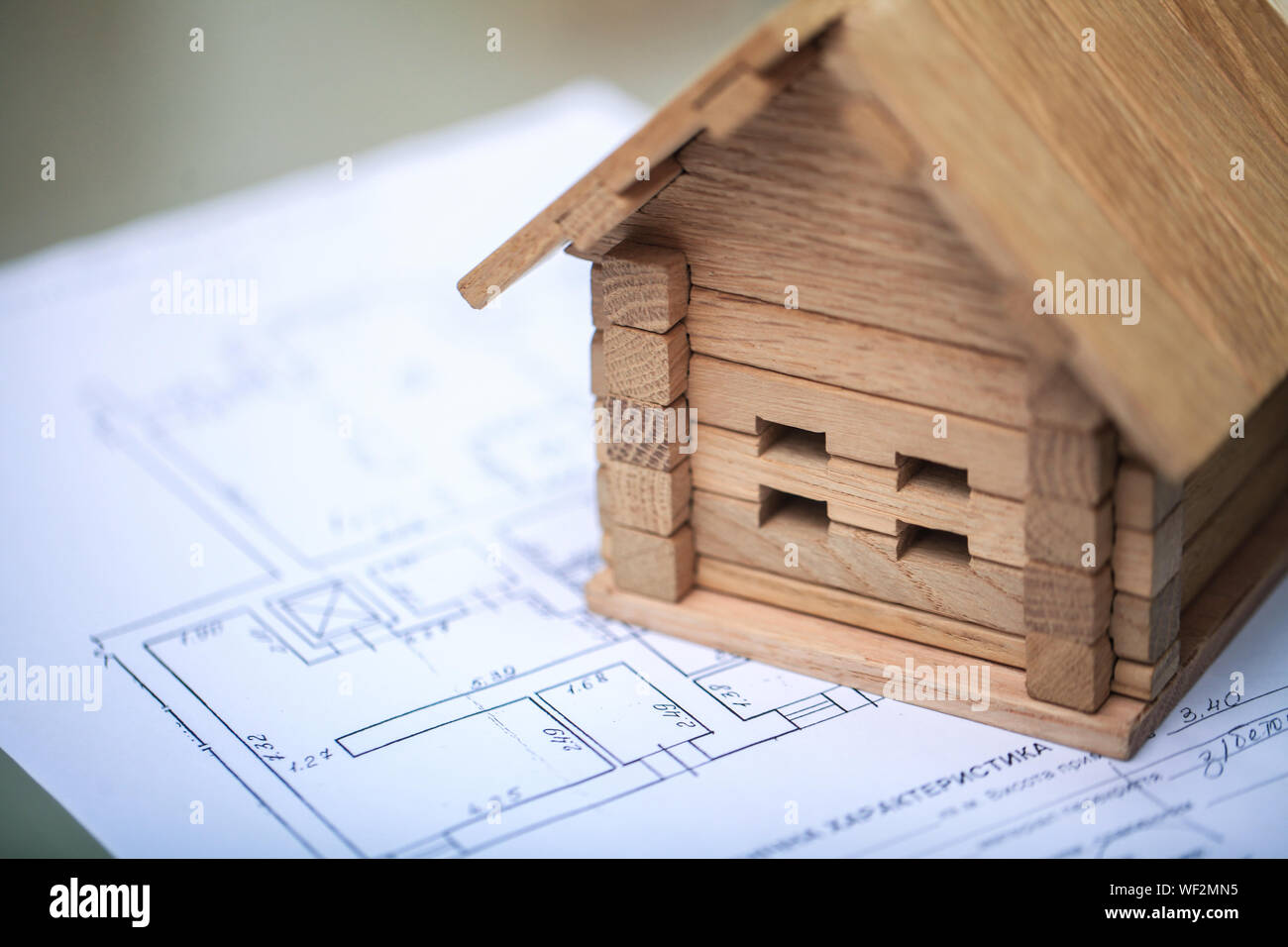 Building house on blueprints with plan - construction project Stock ...