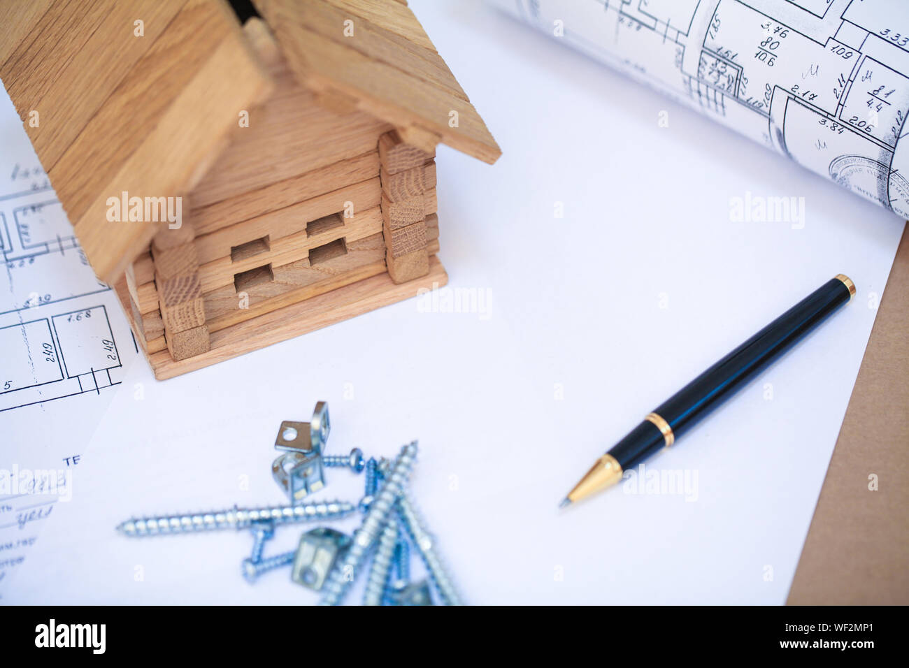 Build new house. House on blueprints - housing project Stock Photo - Alamy