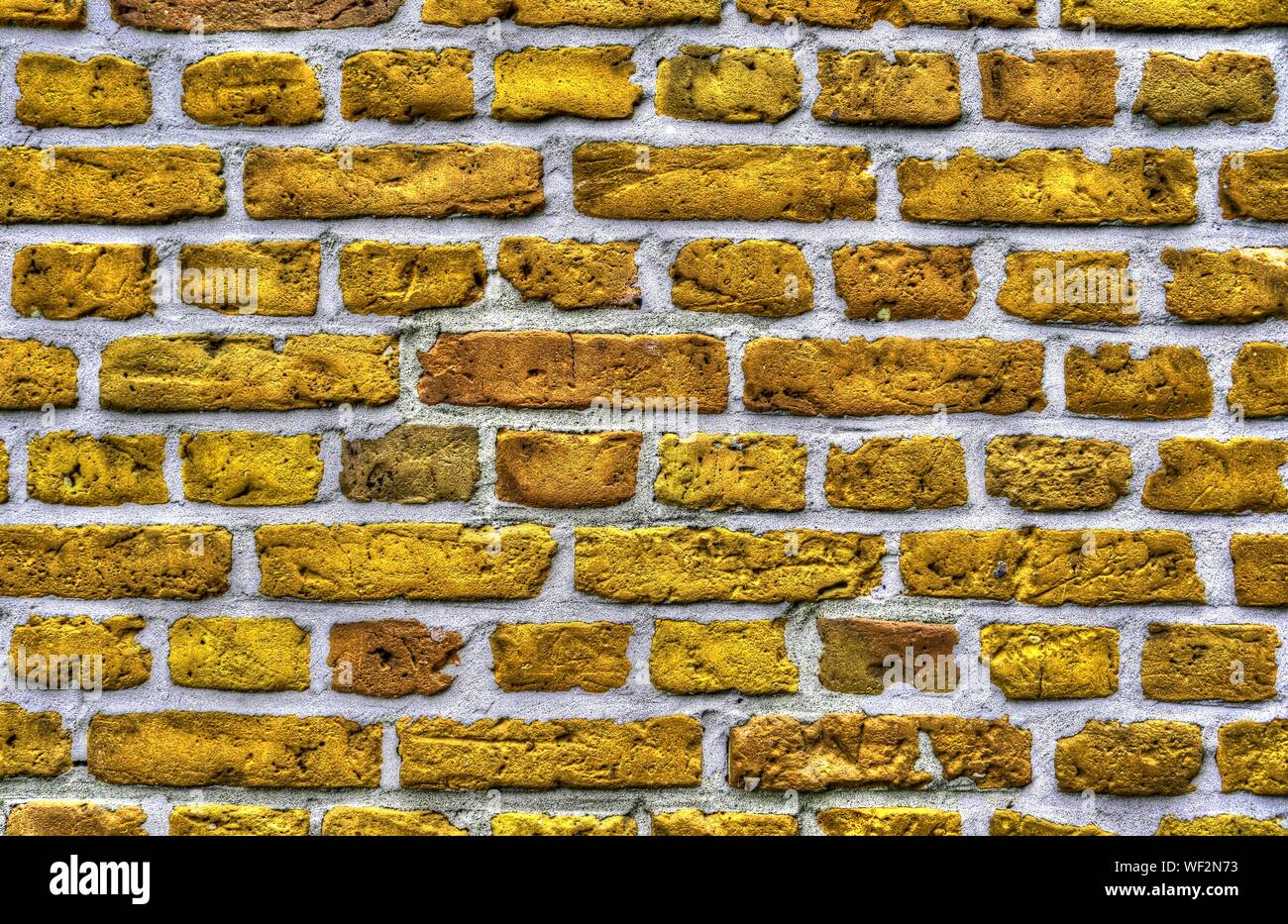 Very detailed texture of yellow brick walls on aged and weathered ...