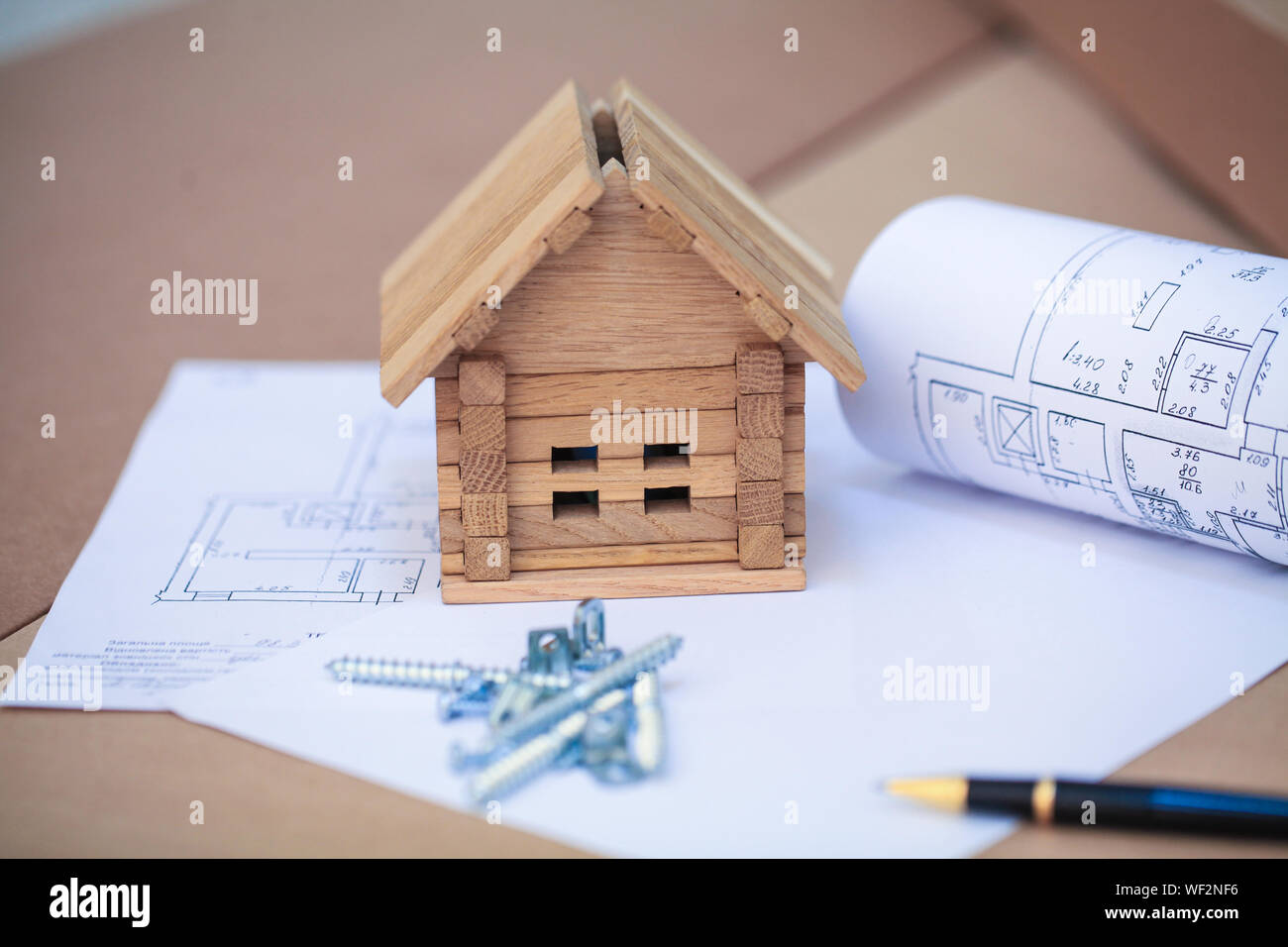 Build new house. House on blueprints - housing project Stock Photo - Alamy