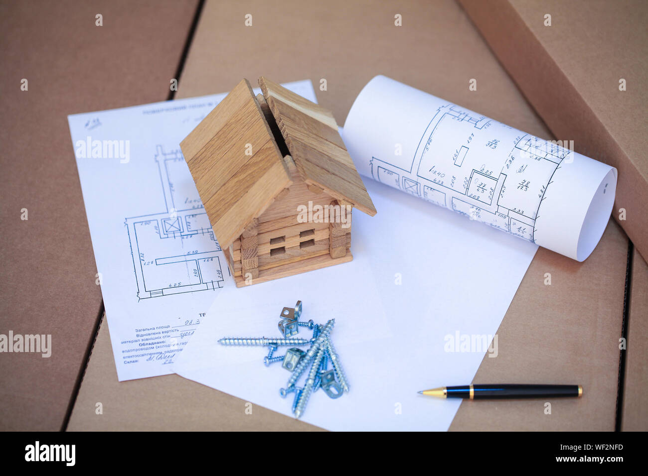 Build new house. House on blueprints - housing project Stock Photo - Alamy