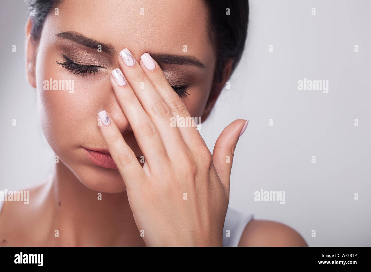 Young sad woman touch forehead and feel strong head ache Stock Photo ...
