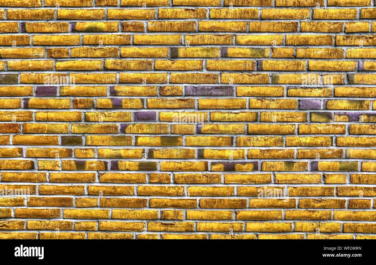 Very detailed texture of yellow brick walls on aged and weathered ...