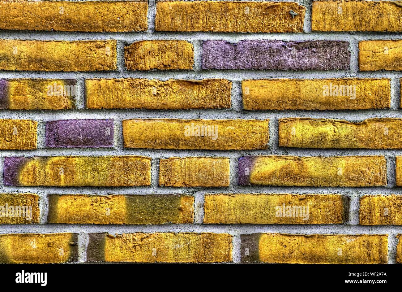 Very detailed texture of yellow brick walls on aged and weathered ...