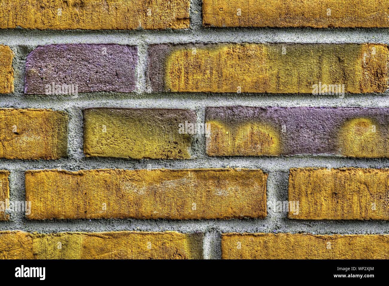 Very detailed texture of yellow brick walls on aged and weathered ...