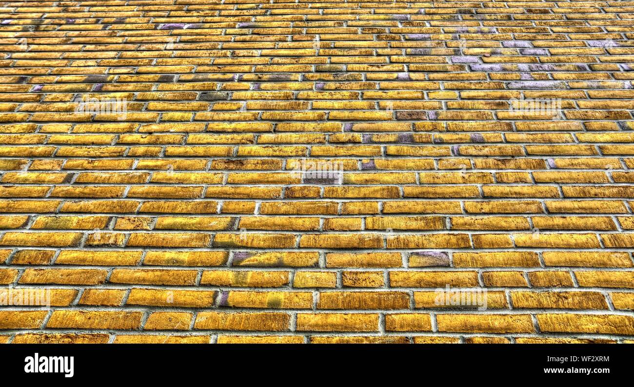 Very detailed texture of yellow brick walls on aged and weathered ...