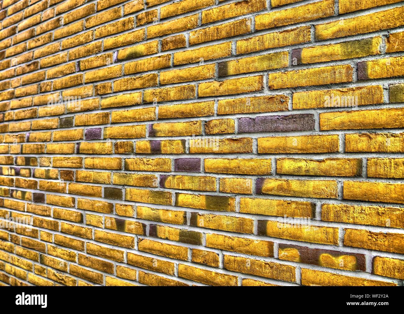 Very detailed texture of yellow brick walls on aged and weathered ...